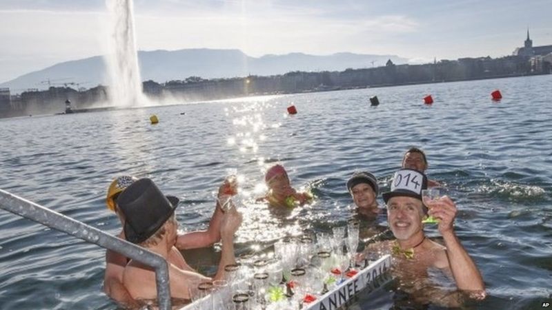 Swimming and singing: New Year in pictures - BBC News