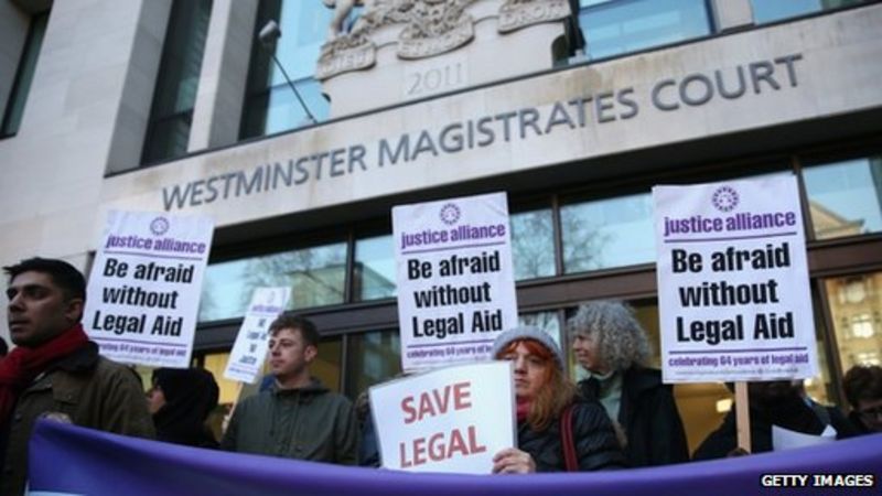 Lawyers protesting outside courts over legal aid cuts - BBC News