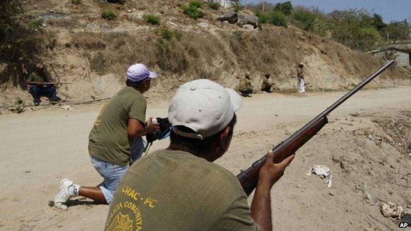 Mexican vigilantes protest against plans to disarm them - BBC News