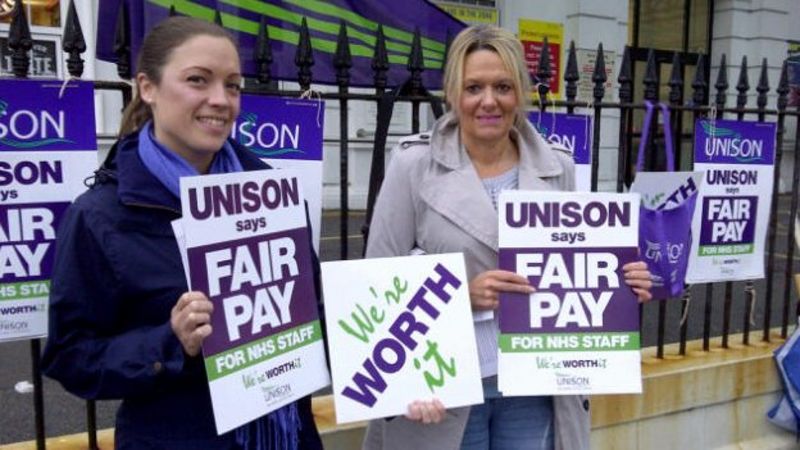 NHS staff strike in dispute over pay - BBC News