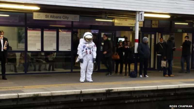 'Astronaut' joins rail commuters at St Albans City station - BBC News