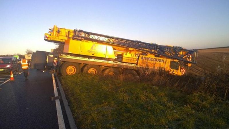 Crane hedge crash causes delays on A38 Trerulefoot roundabout - BBC News