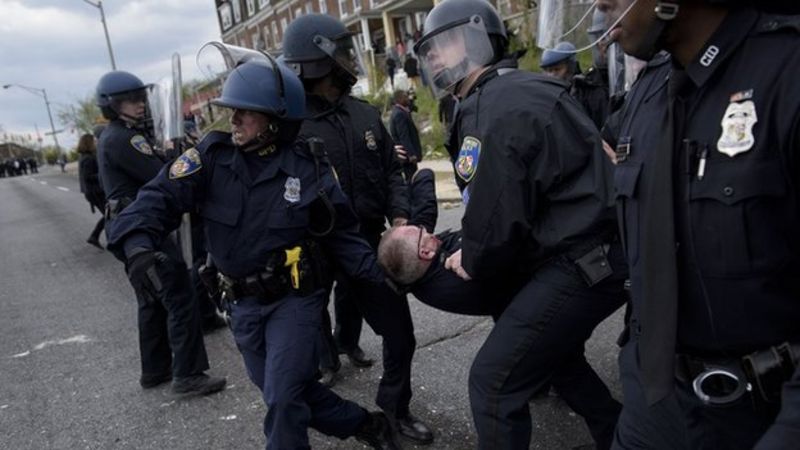 Baltimore riots: Troops deployed as cleanup begins - BBC News