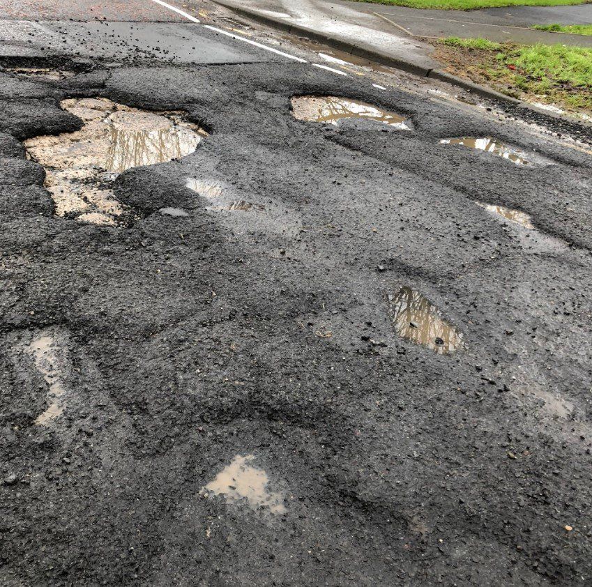 Pothole photos: Your pictures of crumbling roads - BBC News
