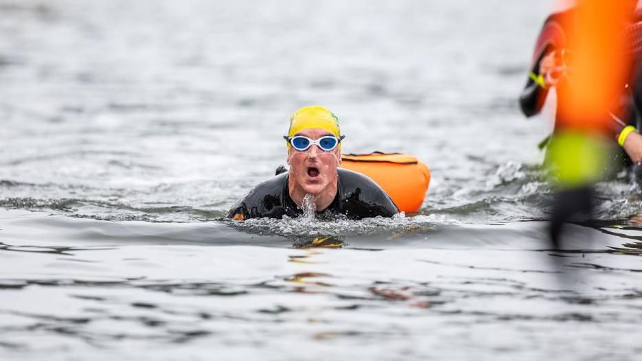 In pictures: The Highlands' Kessock Ferry Swim - BBC News