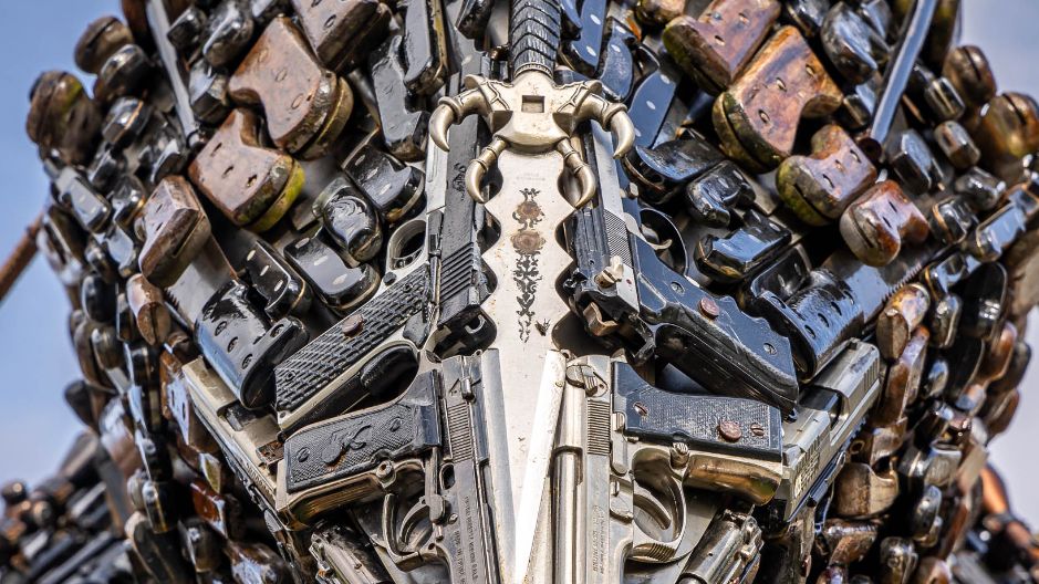 Crewe town centre hosts bee sculpture made of weapons - BBC News