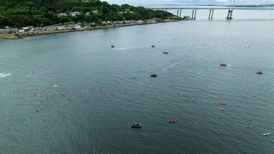 In pictures: The Highlands' Kessock Ferry Swim - BBC News