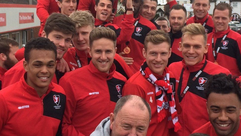 Football champions Cheltenham Town cheered in open-top bus tour - BBC News