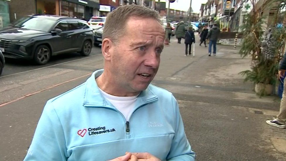 Surrey campaigner calls for more unlocked defibrillators - BBC News