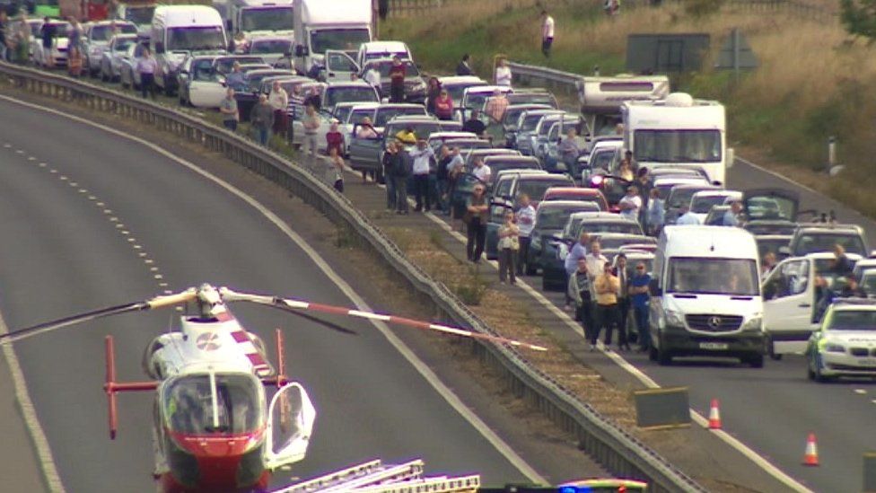 Motorcyclist dies after M11 crash near Duxford air show - BBC News