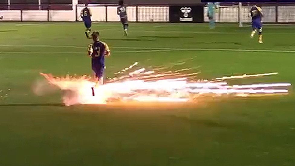 Essex footballer escapes serious firework injury during game - BBC News