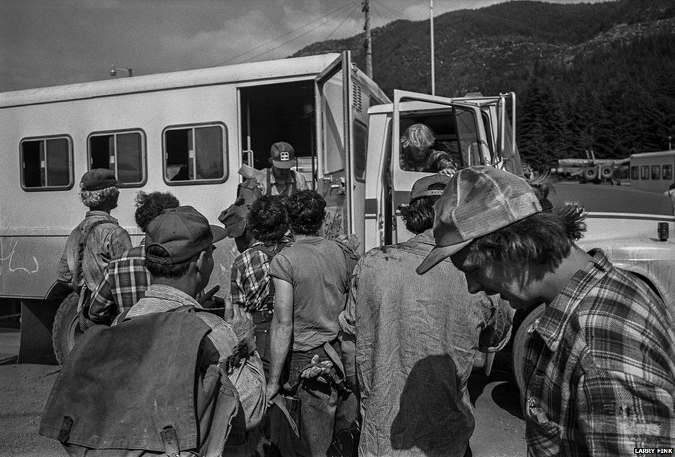 Loggers captured at work in Larry Fink's Opening the Sky - BBC News