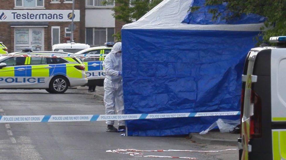 Wisbech murder inquiry: Two charged after body found in hedge - BBC News