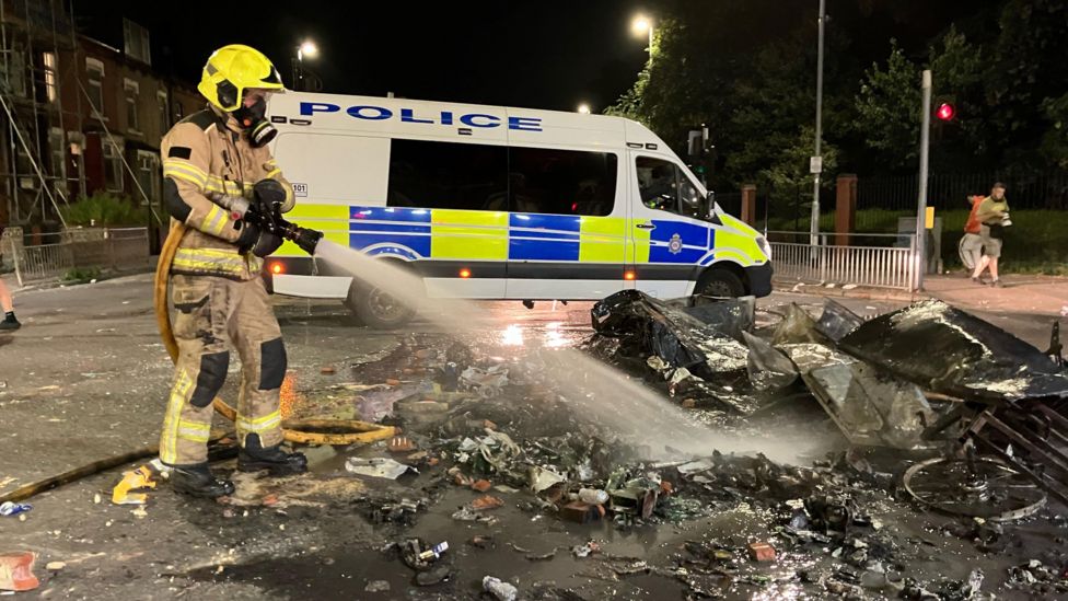 Harehills: Bus destroyed and police car flipped in Leeds disorder - BBC ...