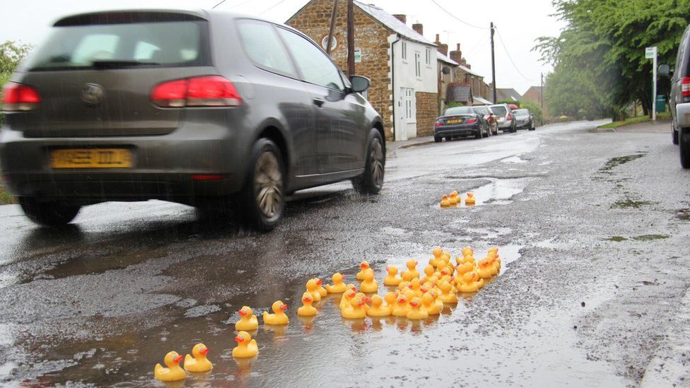Rubber ducks swim in Steeple Aston village potholes - BBC News
