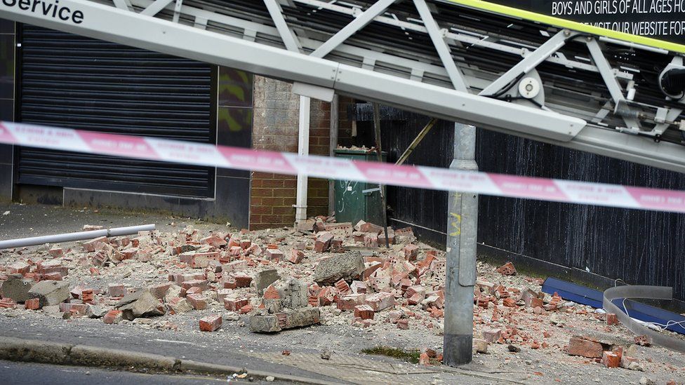 North Belfast: Collapsed wall on building closes Antrim road - BBC News