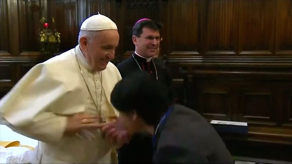 Pope says hand-kiss recoil was 'question of hygiene' - BBC News