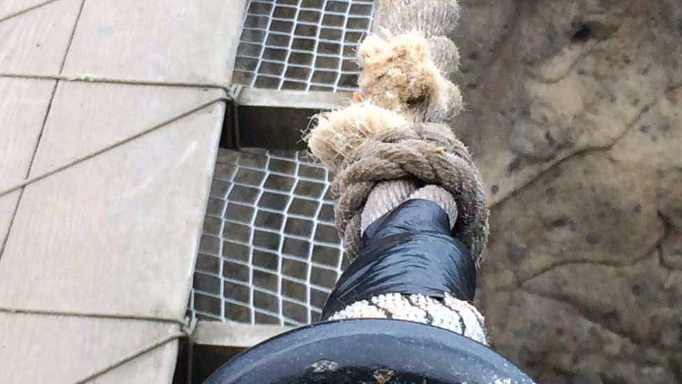 Carrick-a-Rede rope bridge reopens following vandalism - BBC News
