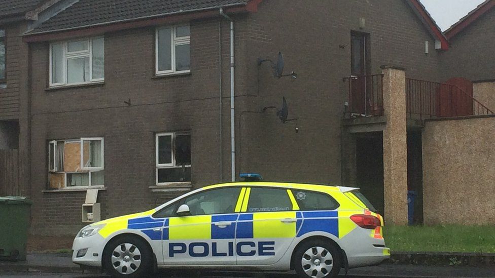 Lisburn flat attacked with petrol bombs - BBC News