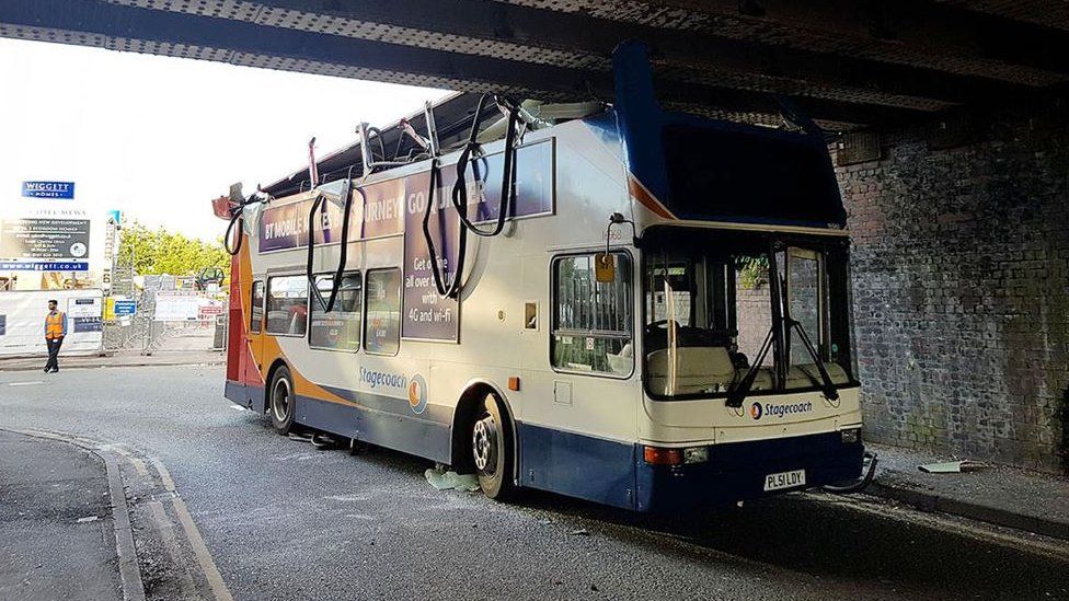 Roof ripped off bus in Middleton railway bridge smash - BBC News