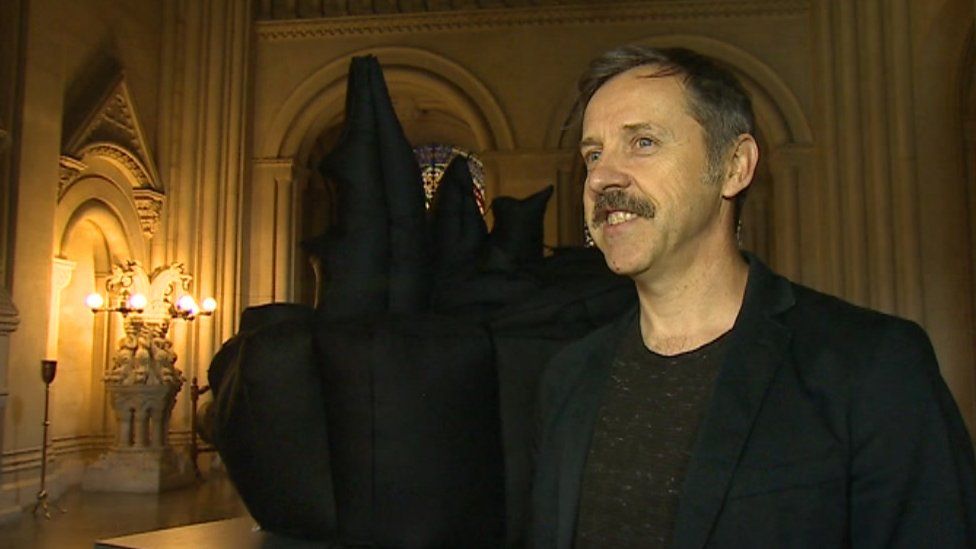 Procession carries new sculpture to Penrhyn Castle - BBC News