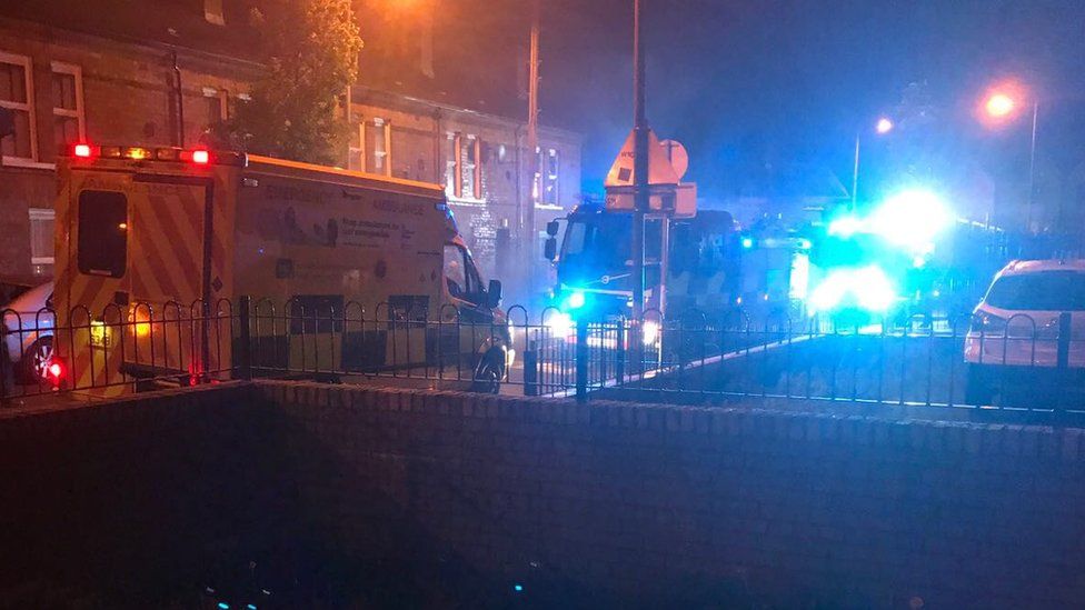 Belfast arson: Woman injured in suspected petrol bomb attack - BBC News