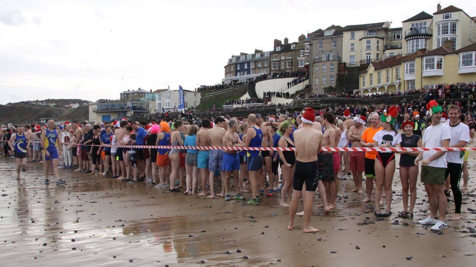 Christmas swims boosted by mild weather - BBC News