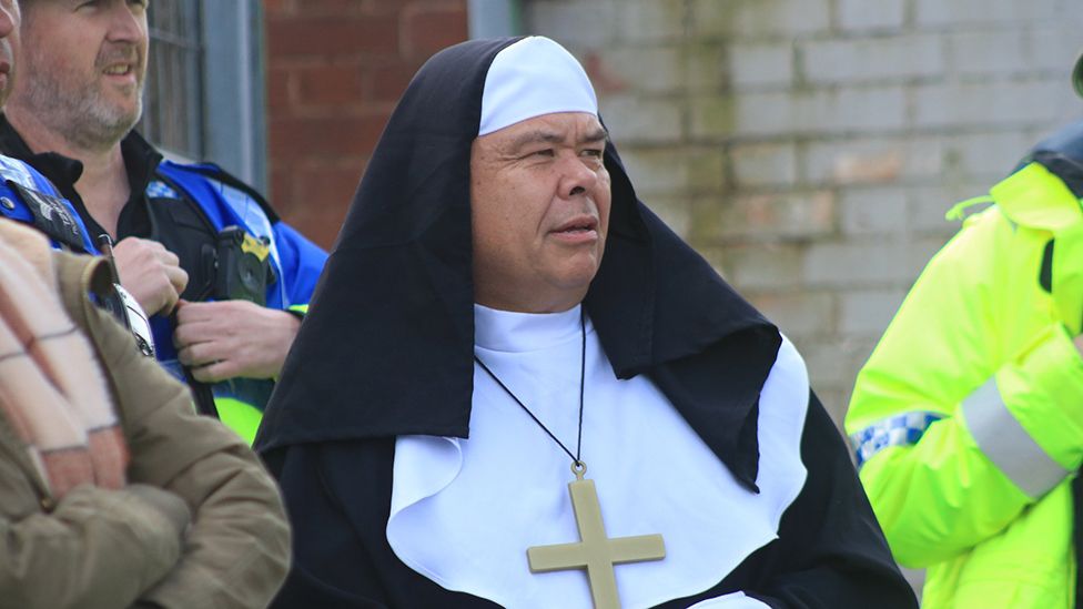 Professor Sir Jonathan Van-Tam dresses as nun for football match - BBC News