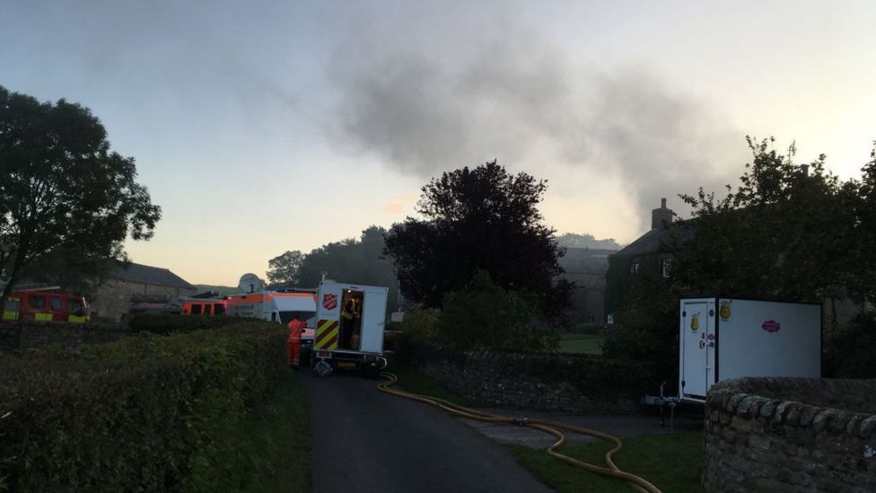 Firefighters tackle huge blaze at Lancashire farm - BBC News