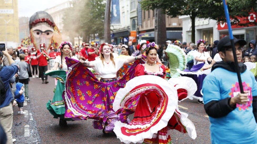 Belfast Mela: Colour and culture returns after pandemic - BBC News