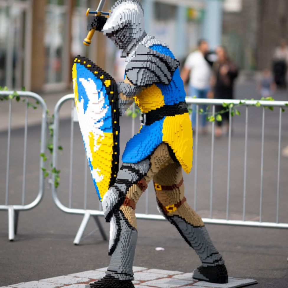 Cardiff Bay Lego show displays fire-breathing 11ft dragon - BBC News