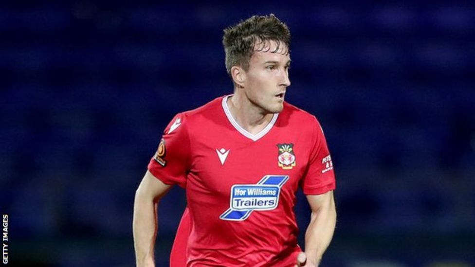 Luke Young: Wrexham captain has contract extended 12 months - BBC Sport