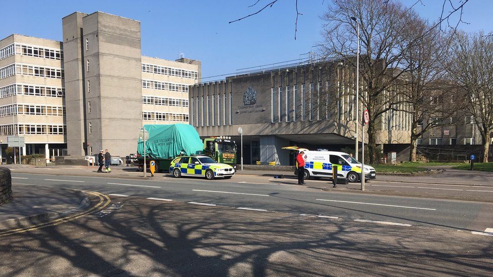 Passenger injured 'exiting' police car in Llanelli - BBC News