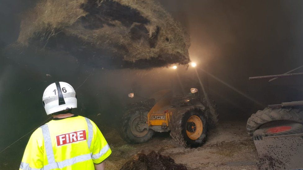 Fire crews tackle 400-tonne hay and straw fire at Corfe Castle barn ...