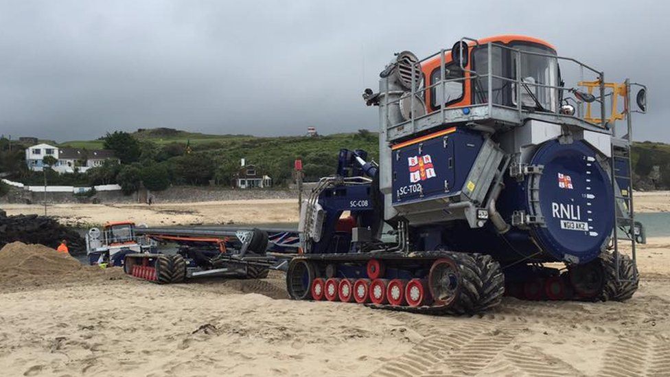 Amphibious RNLI vehicle worth £1m stuck on Cornish beach - BBC News