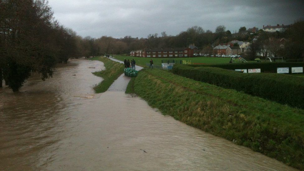 Homes evacuated and A5 and A55 shut in north Wales floods - BBC News