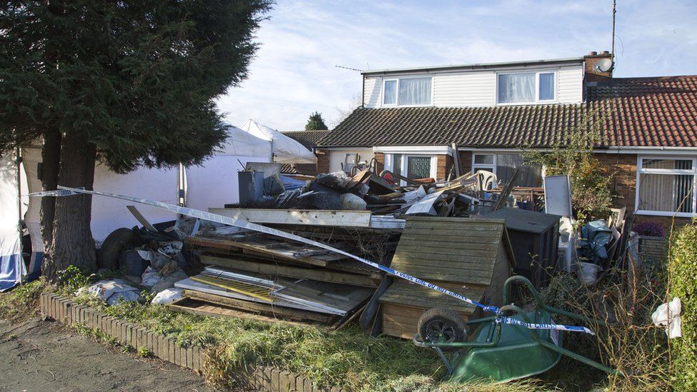 Woman found under rubble in garden had fractured skull - BBC News