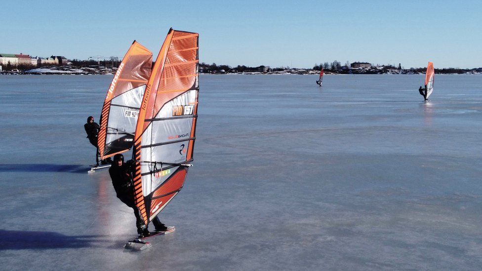 The brave people windsurfing on the frozen sea in Finland! - BBC Newsround