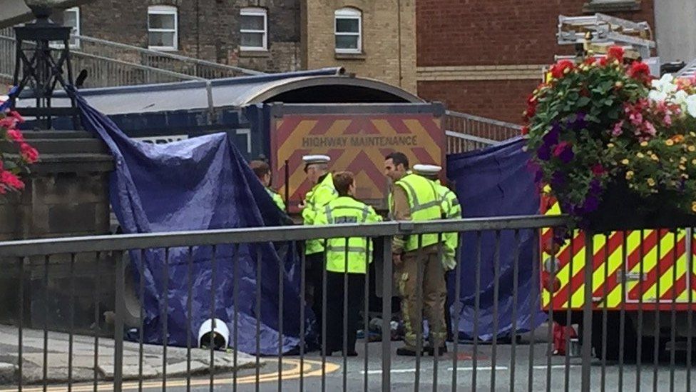 Woman trapped under lorry in Lincoln city centre - BBC News