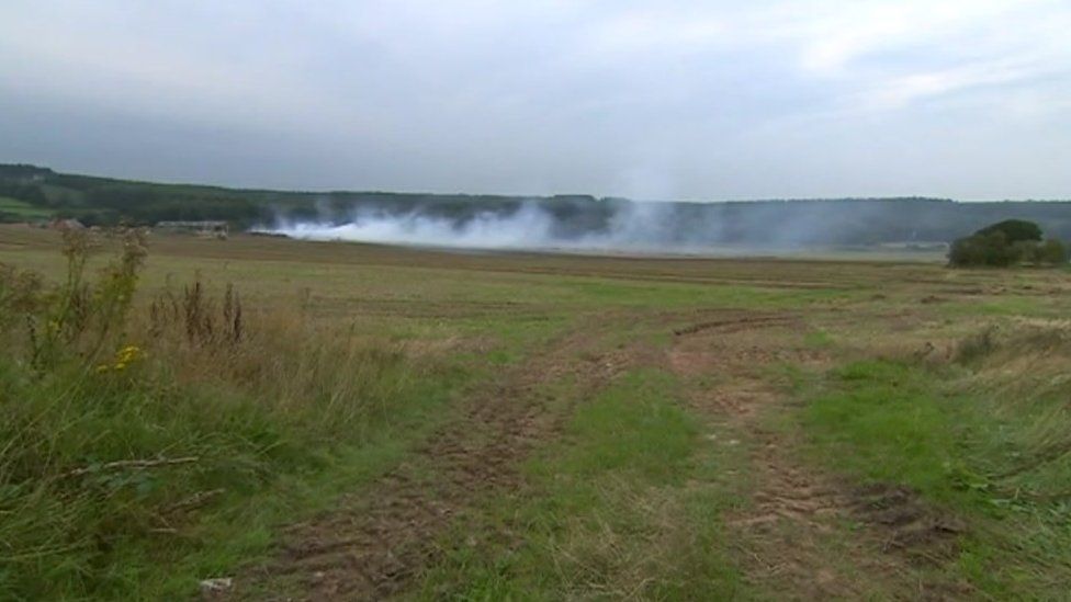 Rugeley residents angry over 10-day wood fire - BBC News