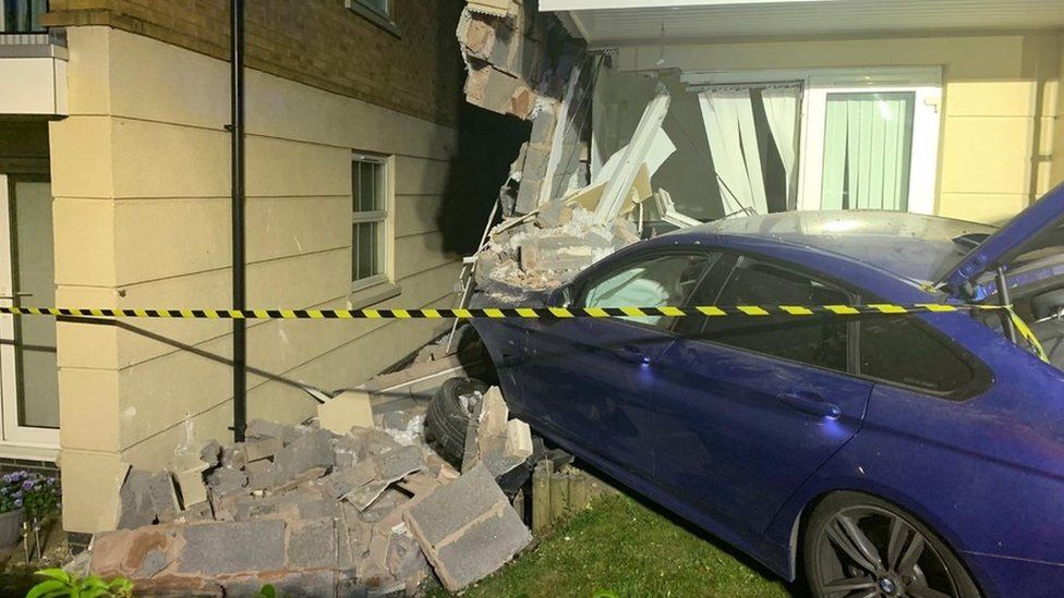 Dudley flats evacuated after car hits building - BBC News