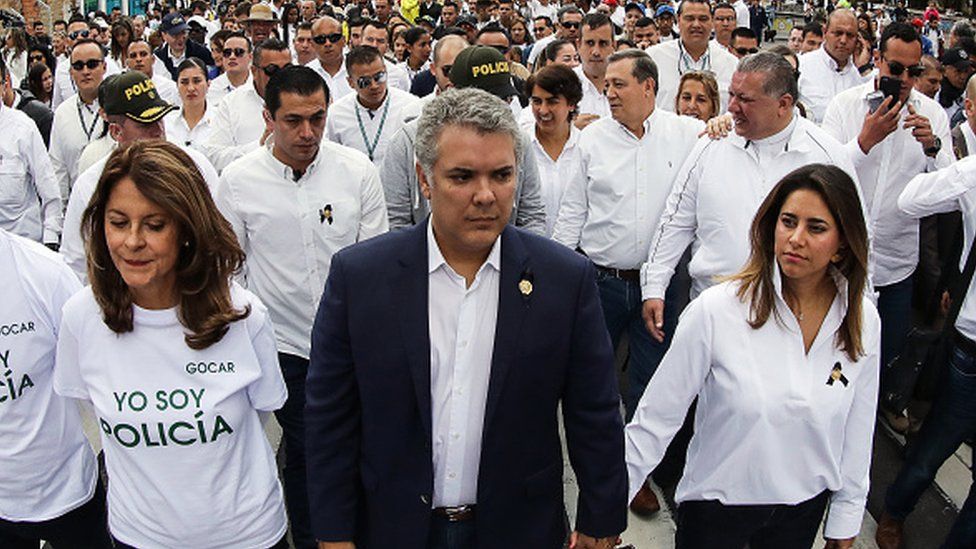 Colombia protest: Thousands march for peace after cadet killings - BBC News
