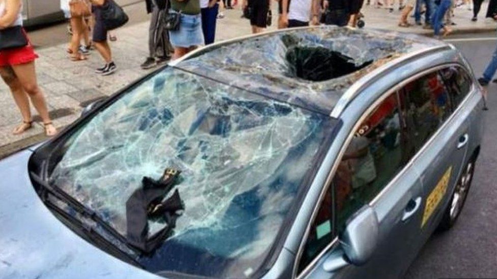 CCTV appeal after England fans damage taxi - BBC News
