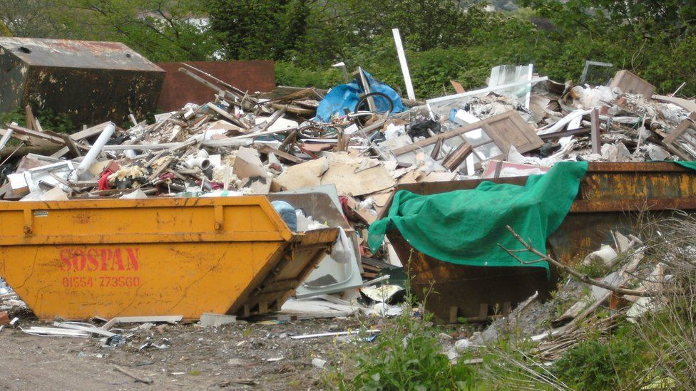 Llanelli's Sospans Skips bosses to pay £180k for illegal dumping - BBC News