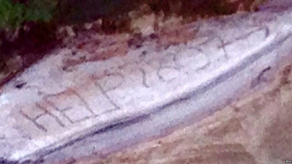 UK tourist rescued after SOS message in sand in Australia - BBC News