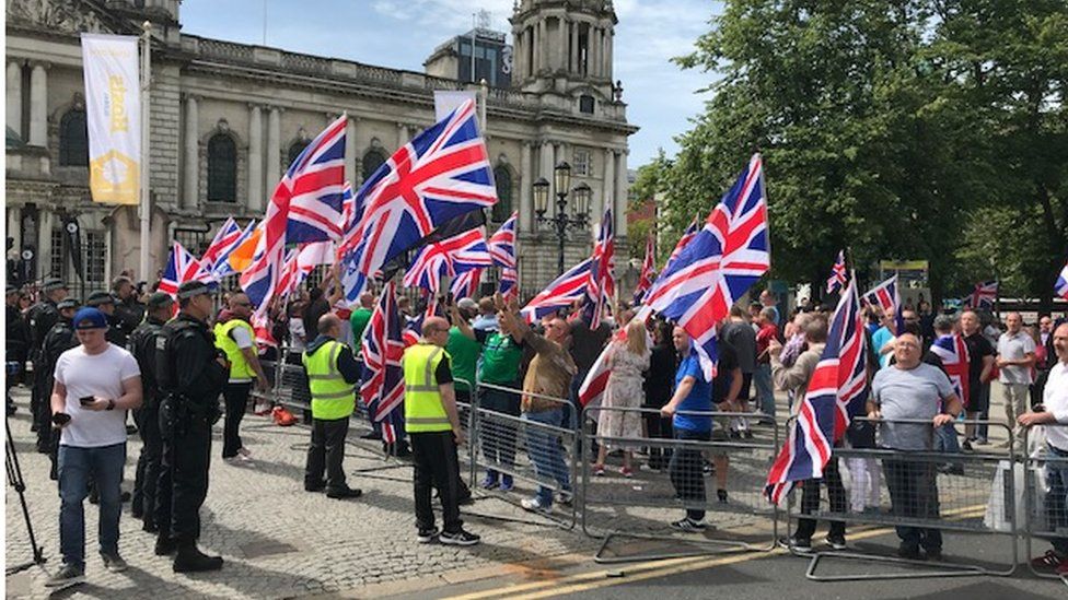 Smoke bombs thrown during Belfast demonstrations - BBC News