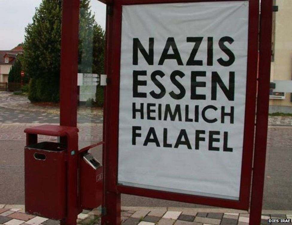 'Nazis secretly eat falafel': German town's pro-refugee posters - BBC News