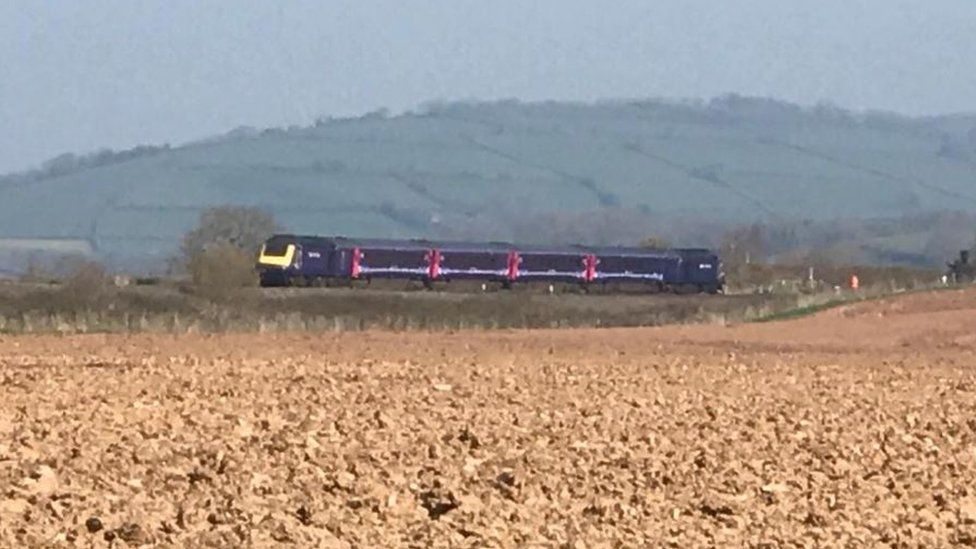 Man, 23, killed in Devon level crossing crash - BBC News