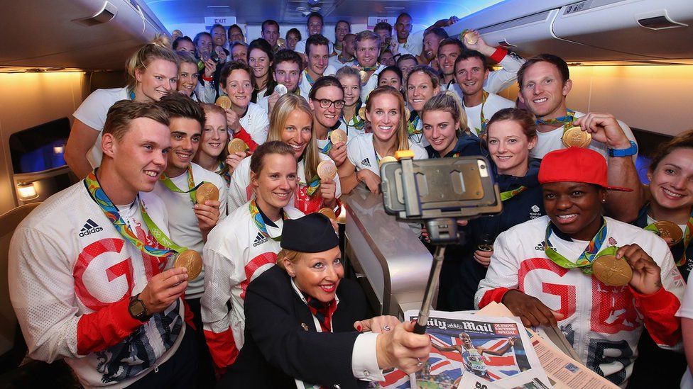 Pictures: Team GB fly home in style with medals around their necks ...