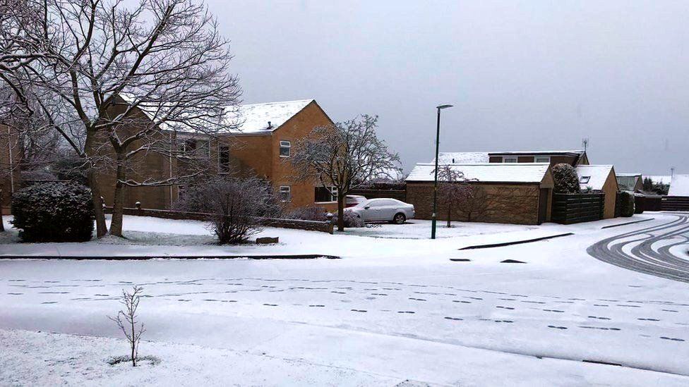 Heavy snow in Midlands leads to travel warnings and road disruption ...